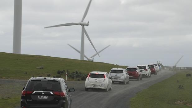 Electric vehicle convoy meets wind turbines at Makara for Drive ...